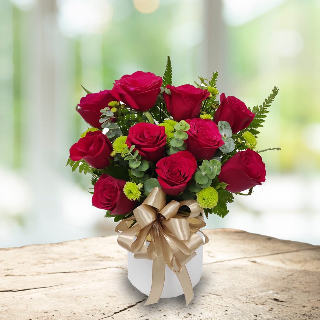 Classic red roses with eucalyptus arranged in a Box - Blooming