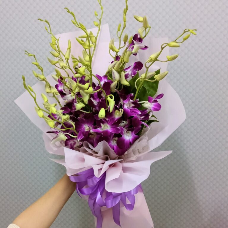 Purple dendrobium Orchid hand bouquet by Blooming Florist