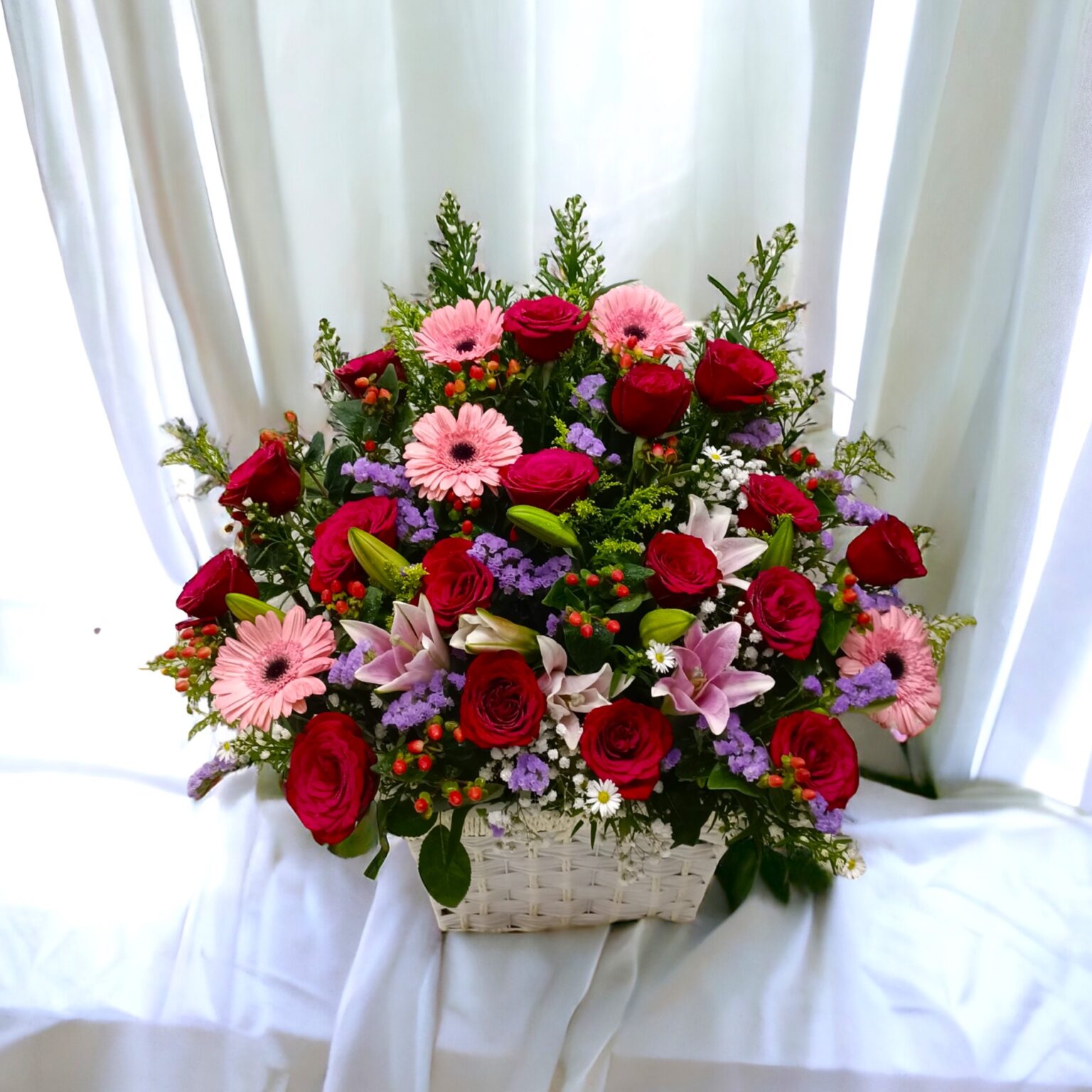 fresh roses, lilies, gerberas, birds of paradise, and gingers - Blooming