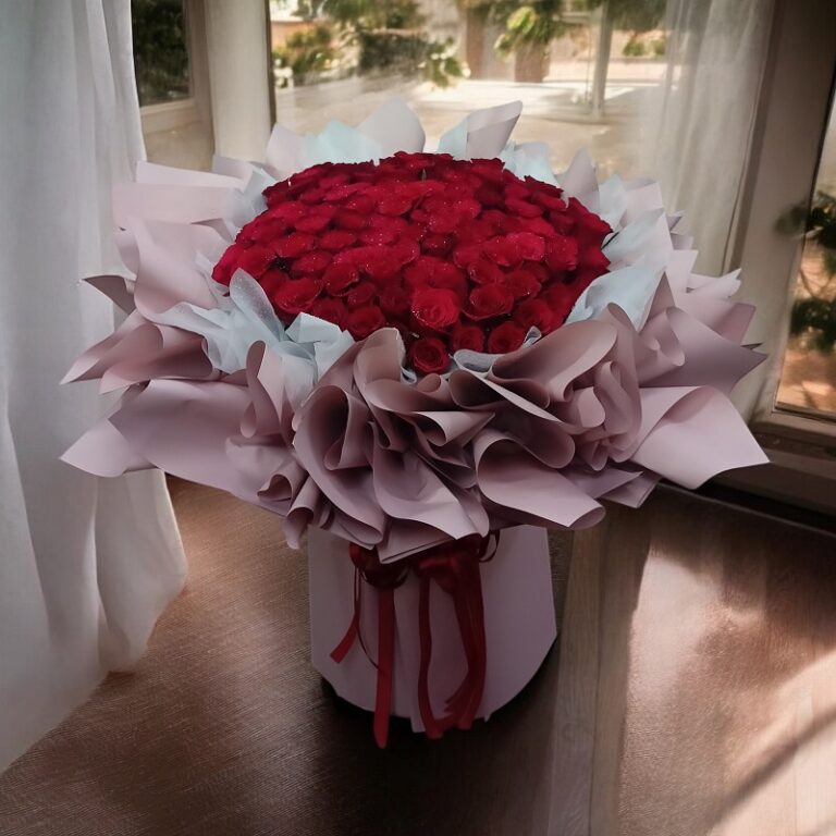 100 red roses hand bouquet delivery by Blooming Florist