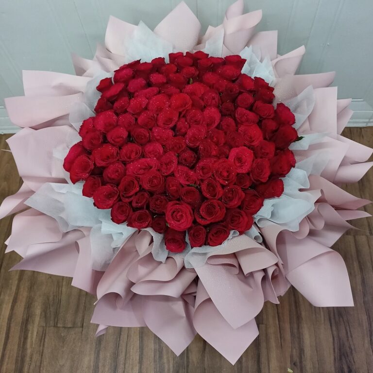 100 red roses hand bouquet delivery by Blooming Florist